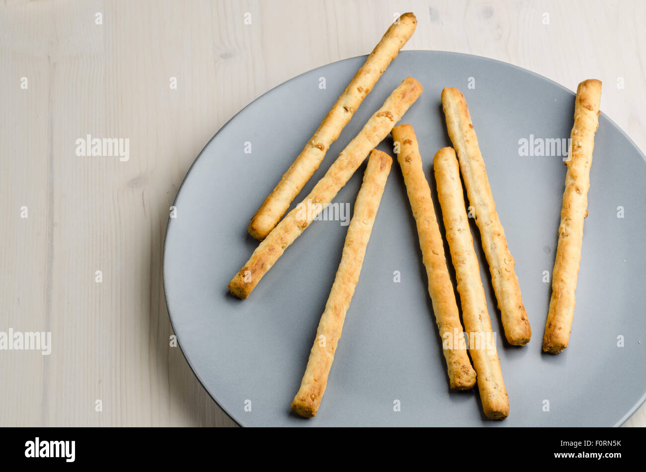 Rustic breadsticks in a dish on wood table hi-res stock photography and ...