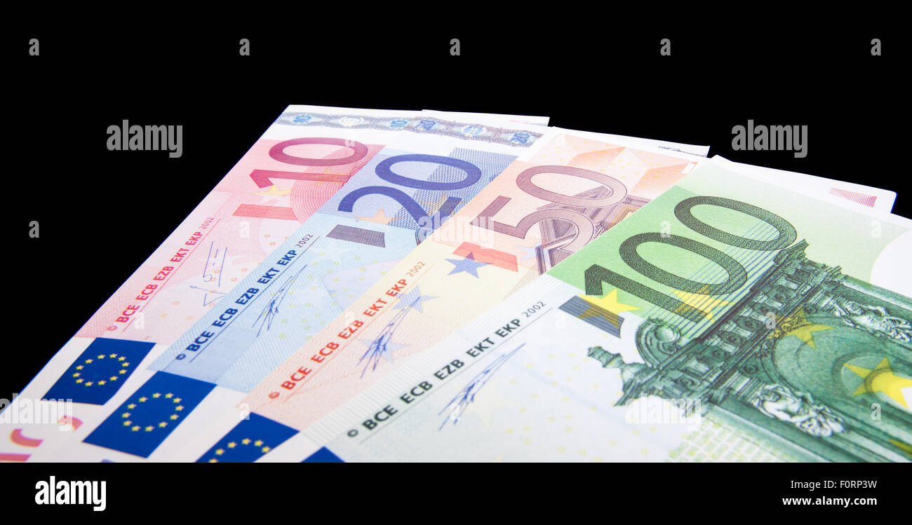 Various euro notes isolated on black background Stock Photo - Alamy