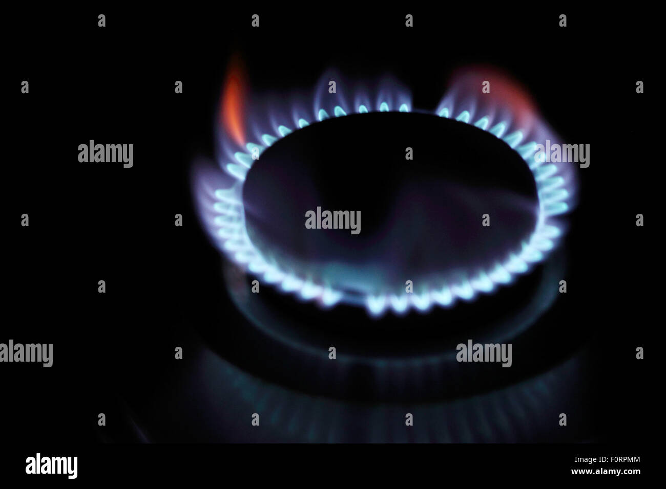 one flame a gas stovel in home cooking Stock Photo - Alamy