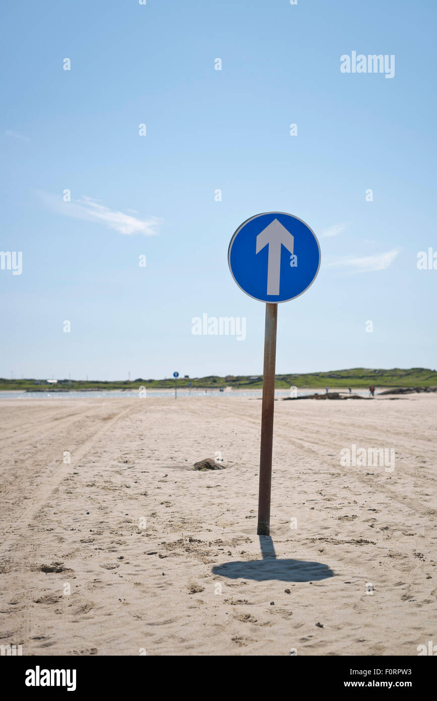 Signs showing the beach route to Omey Island Stock Photo - Alamy