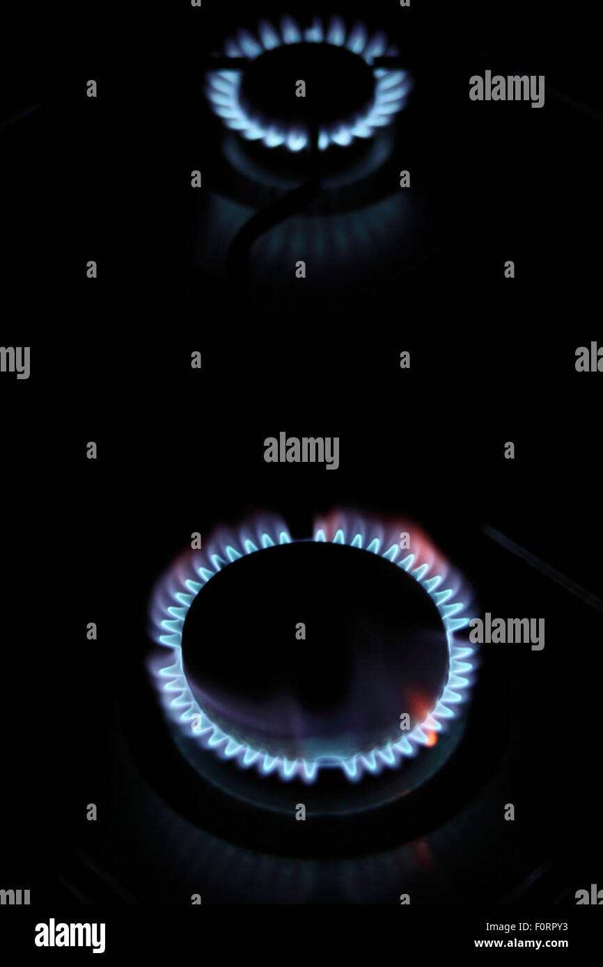 two flame a gas stovel in home cooking Stock Photo - Alamy
