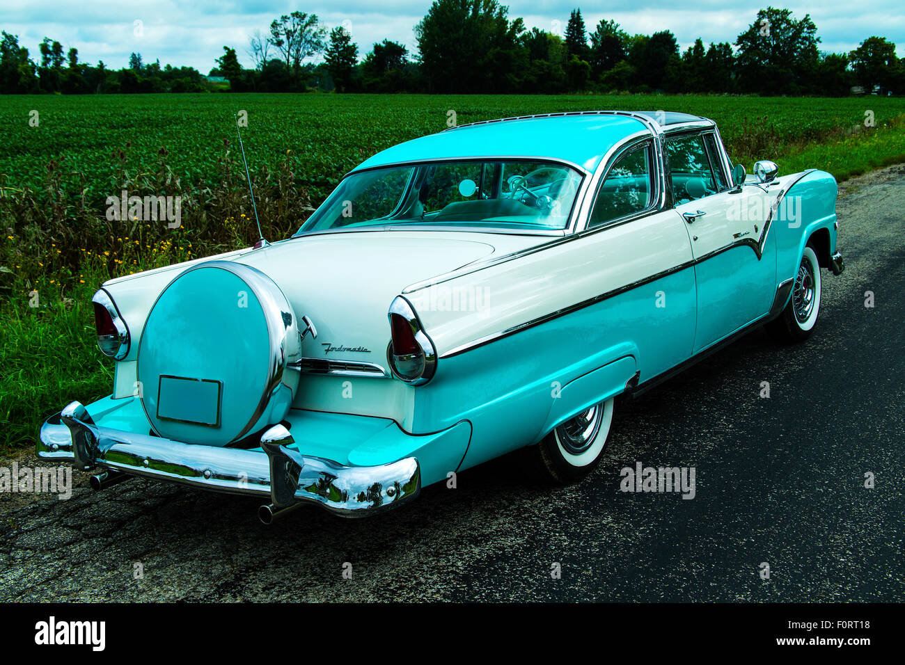 1955 Ford Fairlane Crown Victoria on pavement rear view Stock Photo - Alamy
