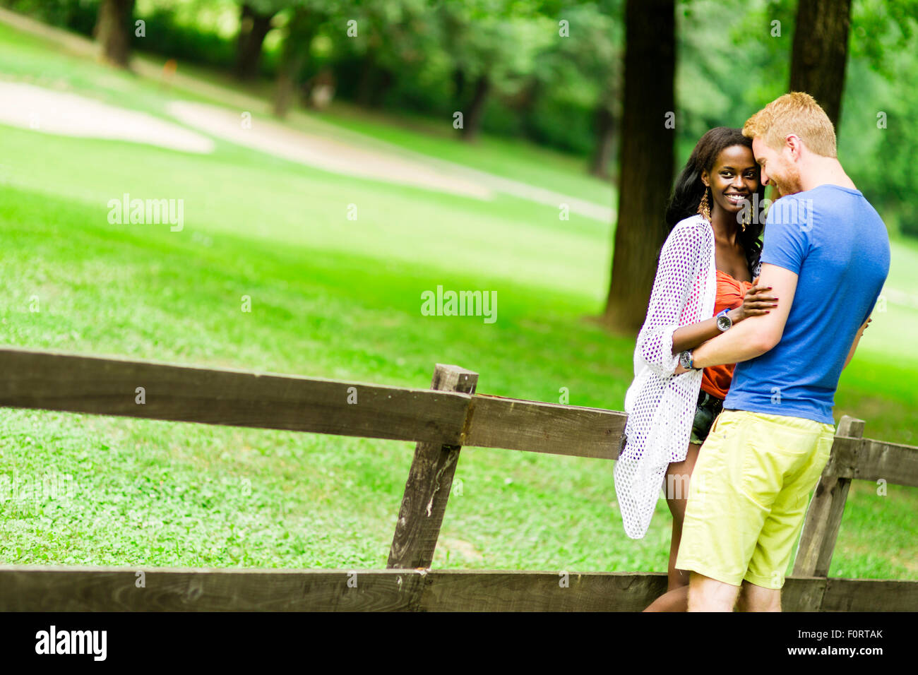 A happy couple in love spending some time together outdoors in a park ...