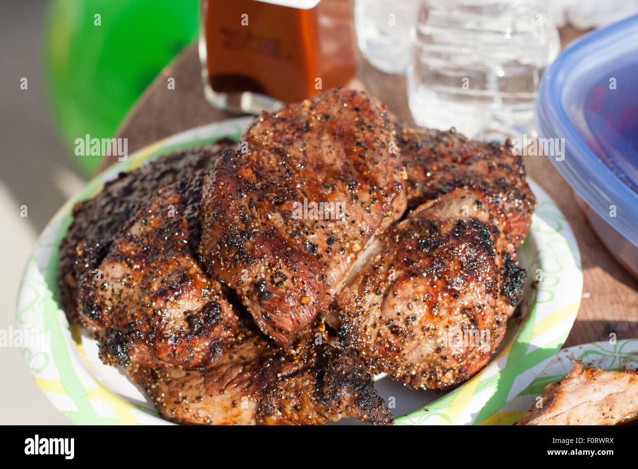 Barbecue steak on a paper plate Stock Photo - Alamy
