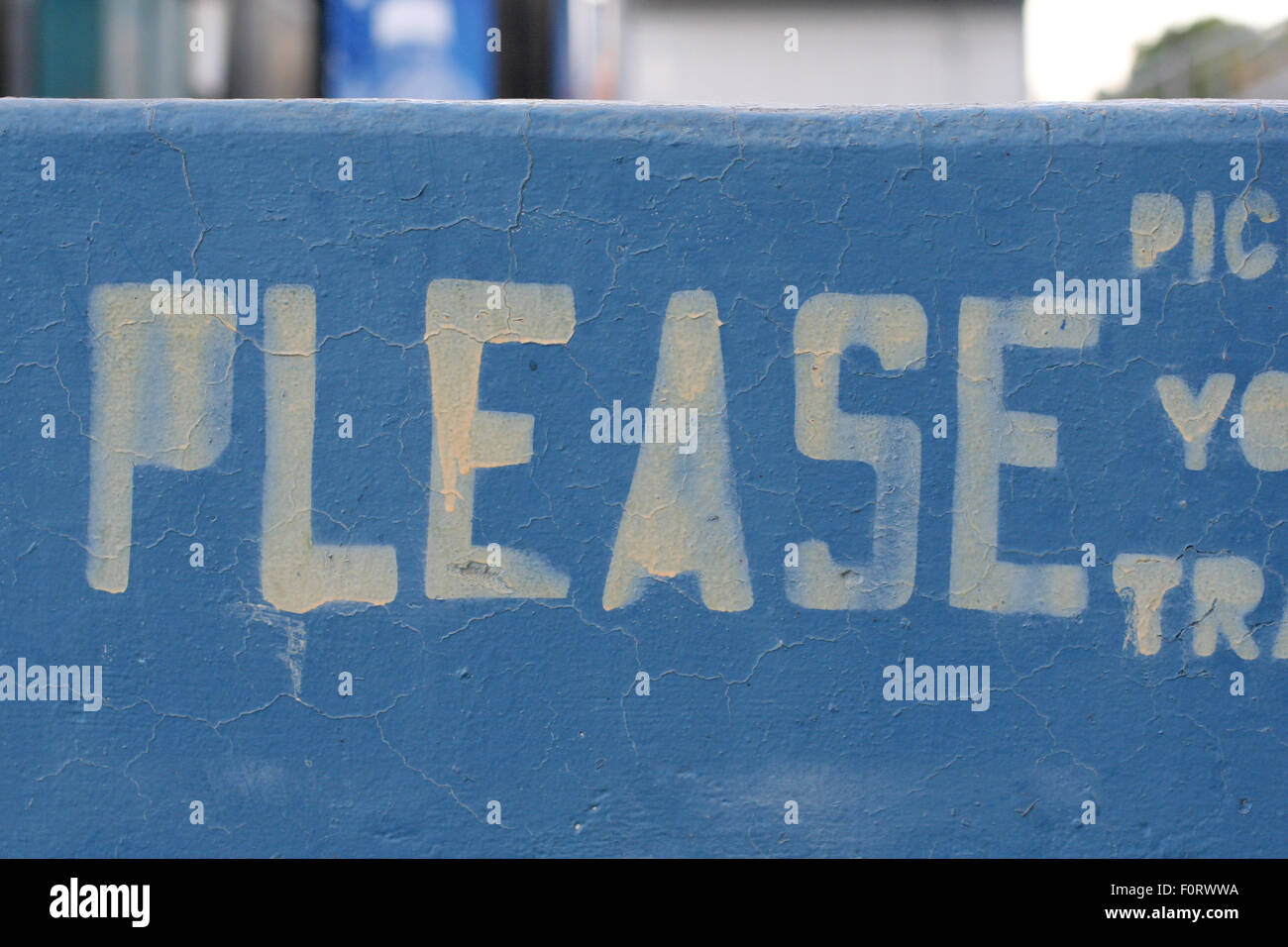 Please white paint on blue Stock Photo - Alamy