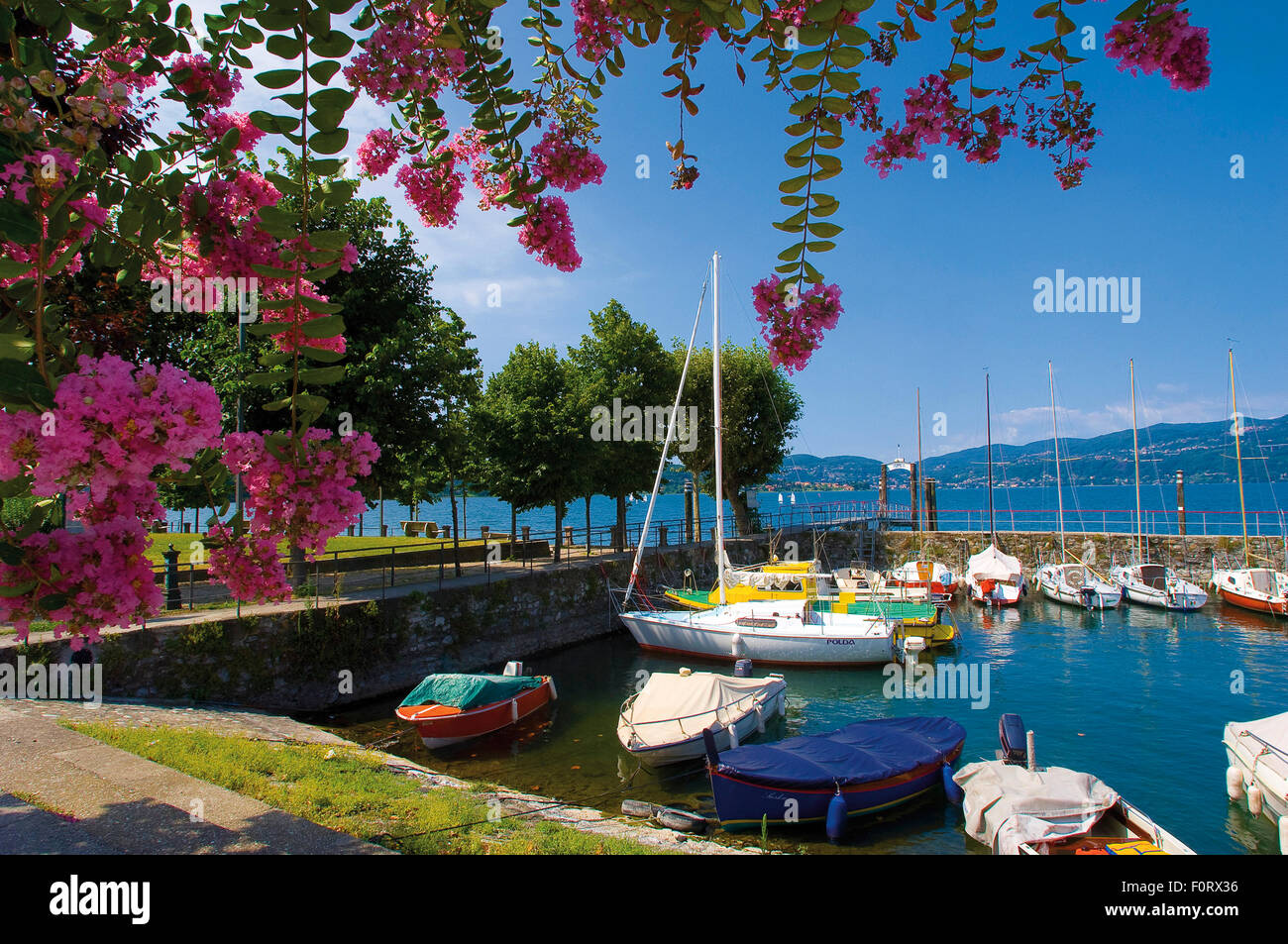 Ispra Port and lakeside road Stock Photo - Alamy