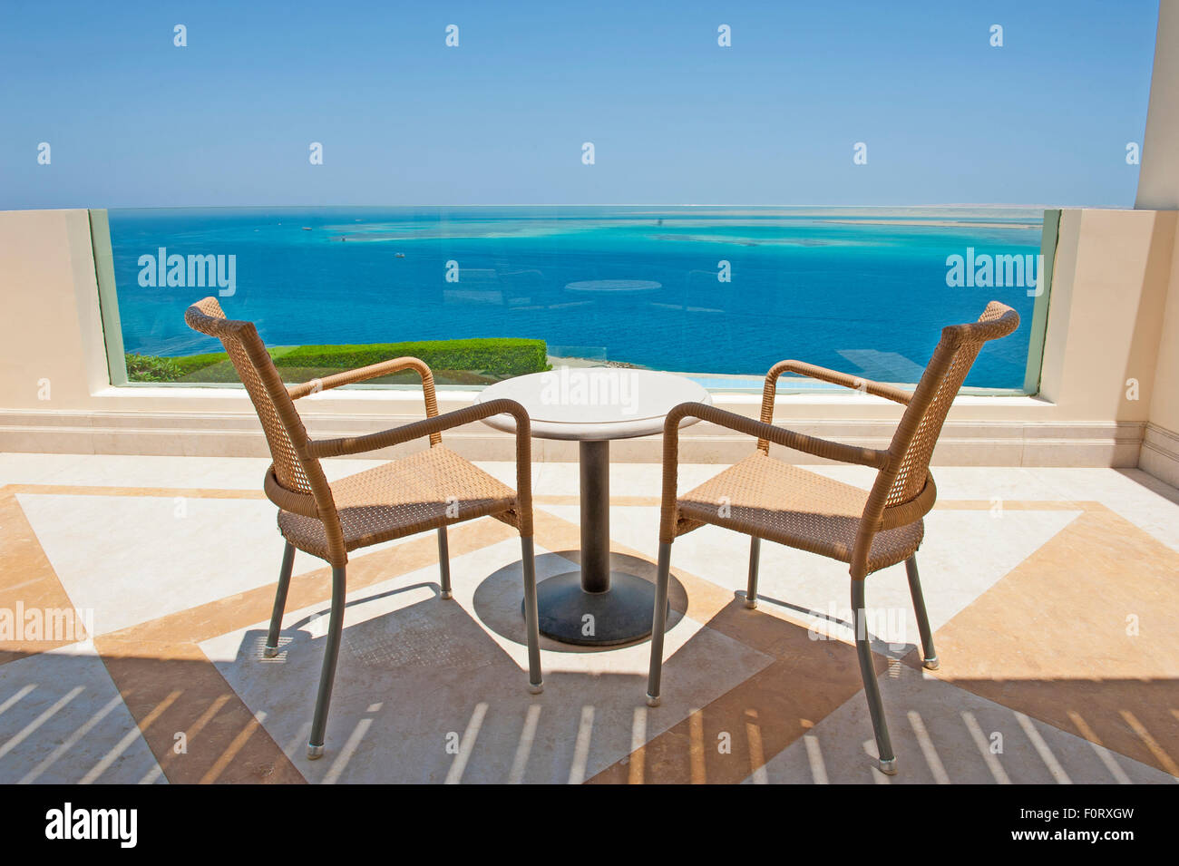 Tropical sea view from the balcony of a luxury resort with table and ...