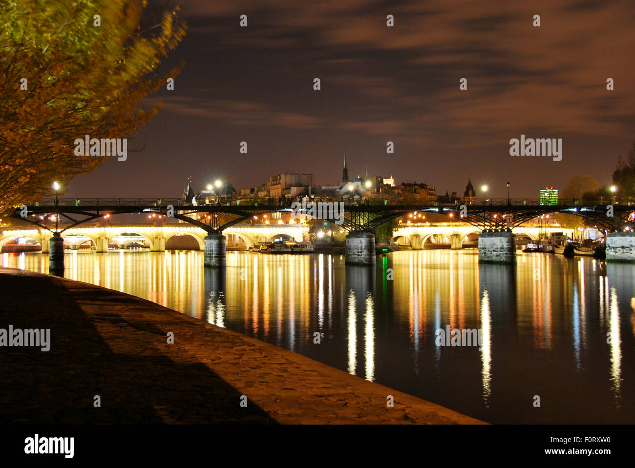 Bridge in Paris by night Stock Photo - Alamy