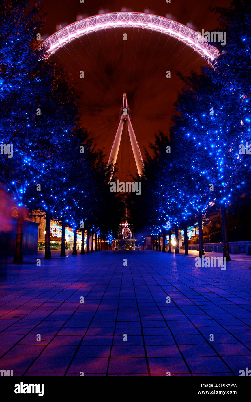 London, United Kingdom - July 18, 2009: London Eye, at night with blue ...