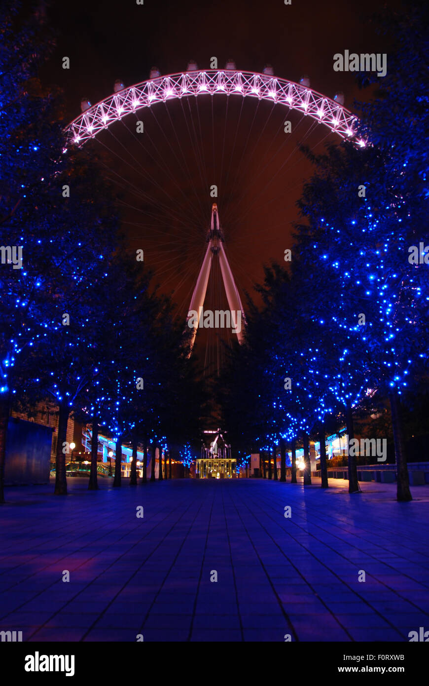 London, United Kingdom - July 18, 2009: London Eye, at night with blue ...