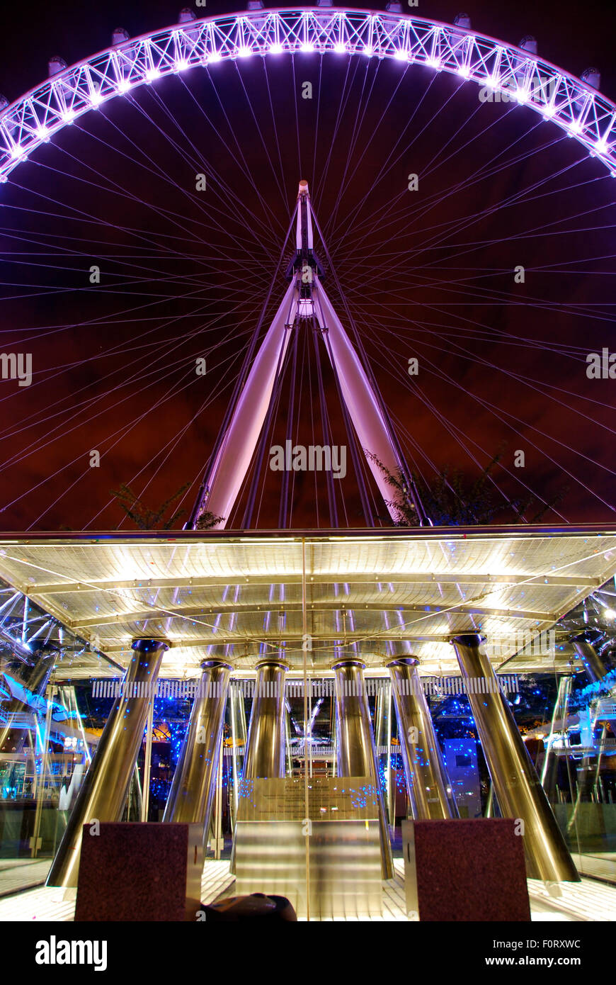 London, United Kingdom - July 18, 2009: London Eye, at night with blue ...