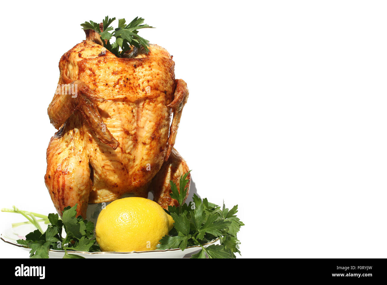 Whole cooked chicken on white background Stock Photo - Alamy