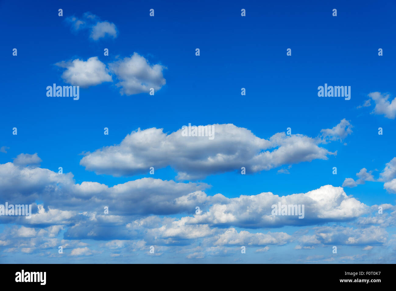 Blue sky and white cloud background texture Stock Photo - Alamy