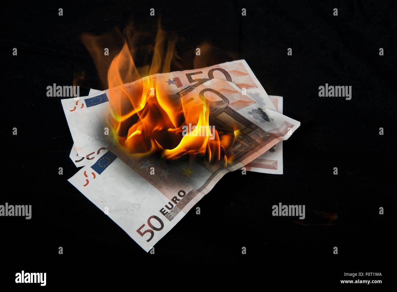 50 euro notes on fire Stock Photo - Alamy