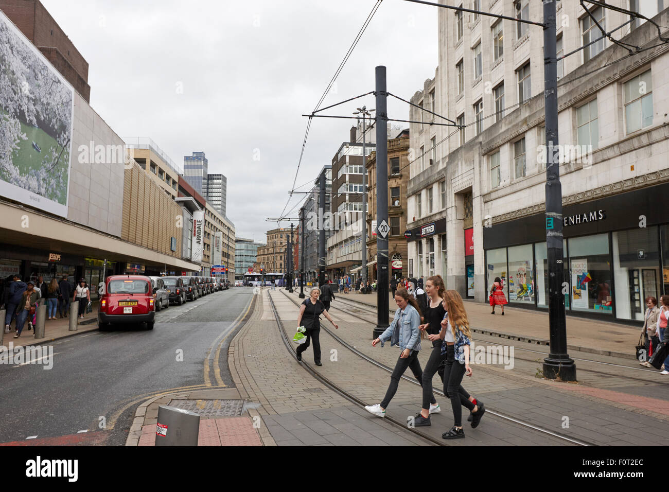 high street with tram lines Manchester England UK Stock Photo - Alamy