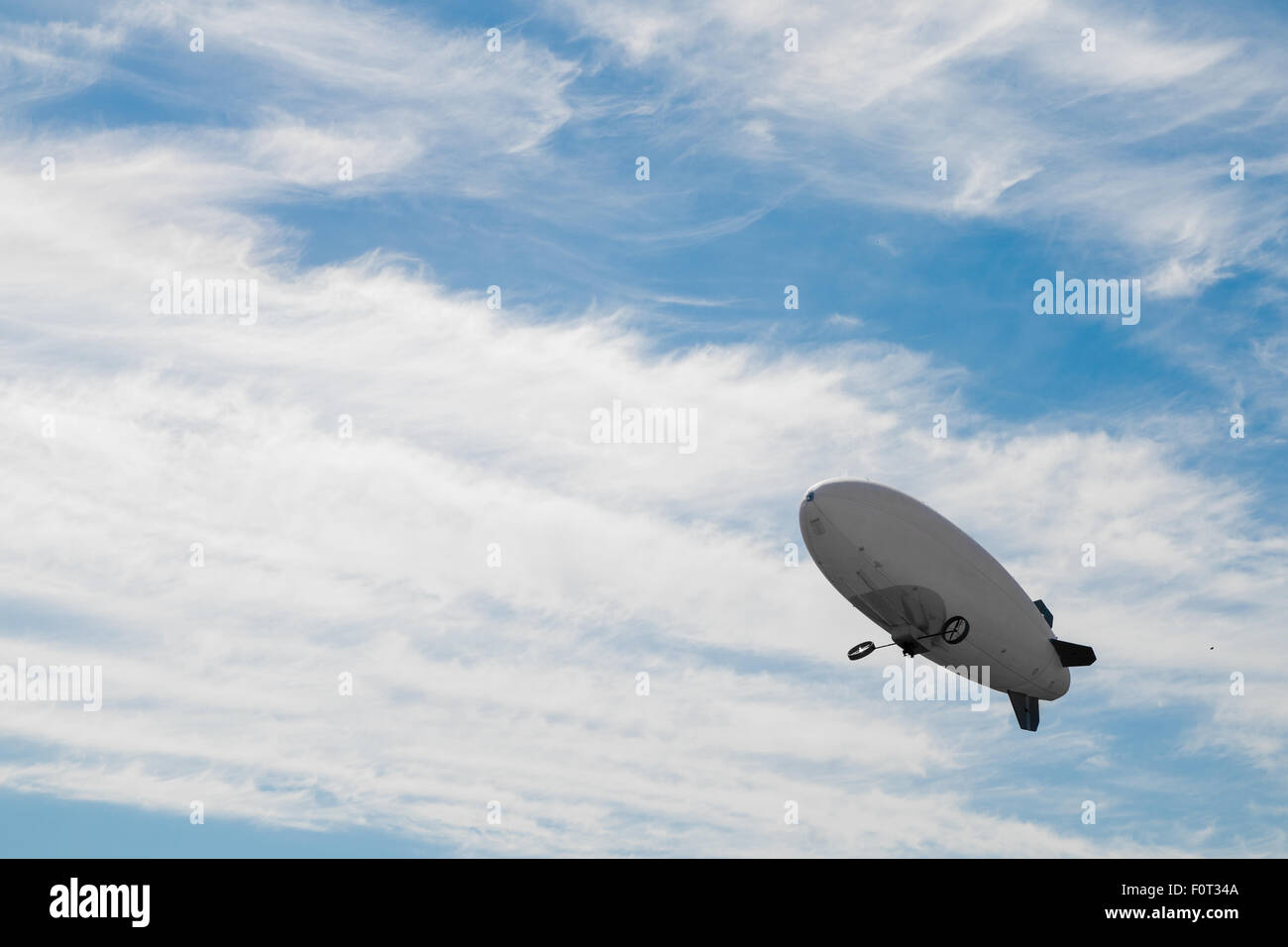 Blue blimp flying in hi-res stock photography and images - Alamy