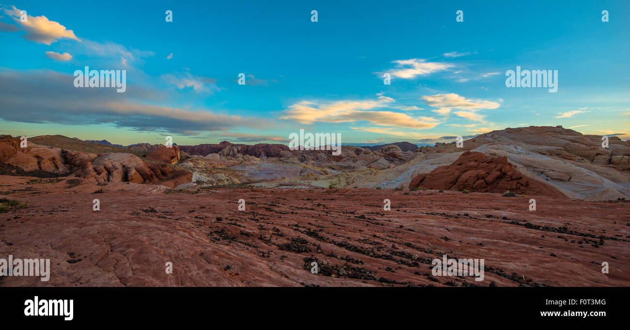 Fire Wave Panorama black pebbles, multicolored rock formations and blue ...