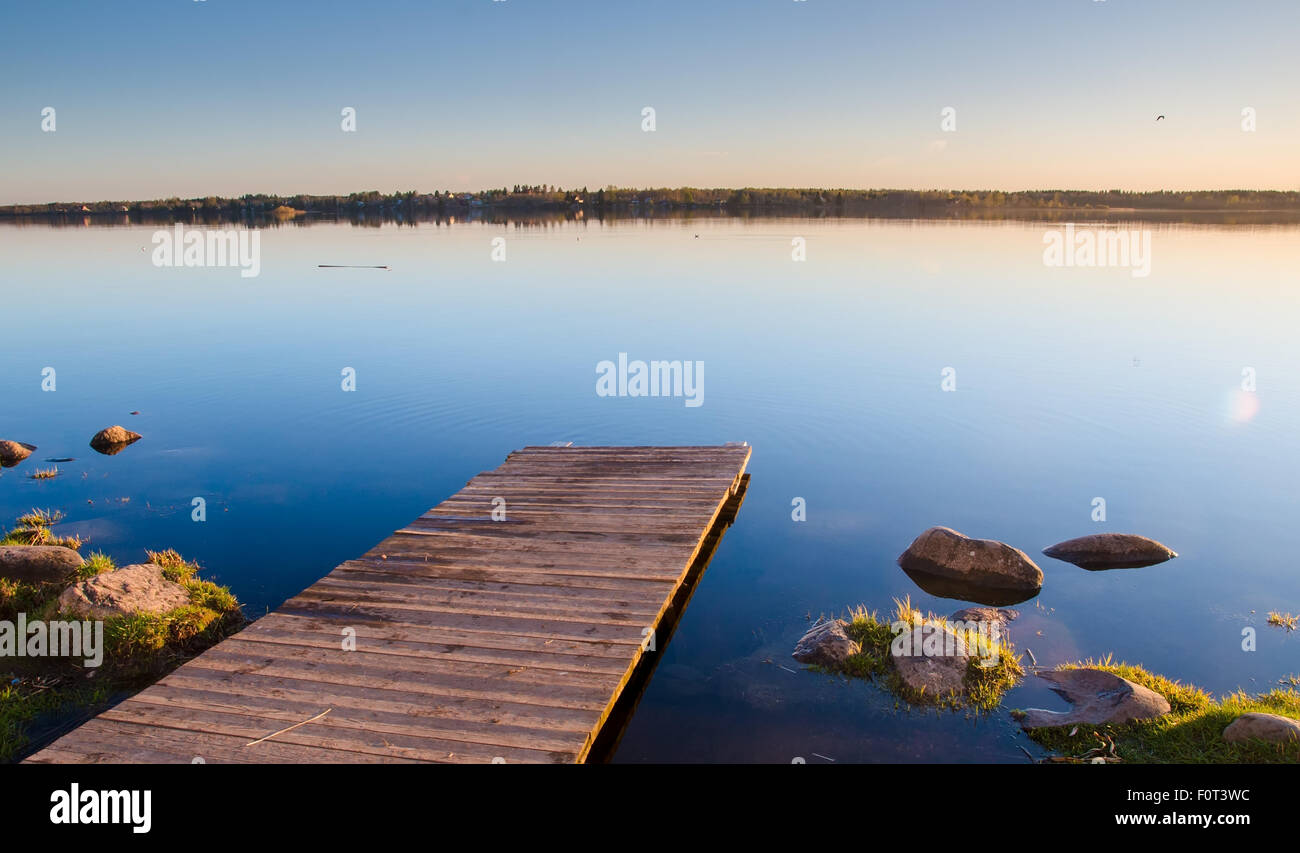 wooden walkway leading into the water Stock Photo - Alamy