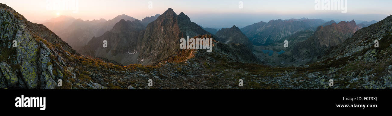 Panoramic image of High Tatras peaks from Rysy summit during sunrise ...