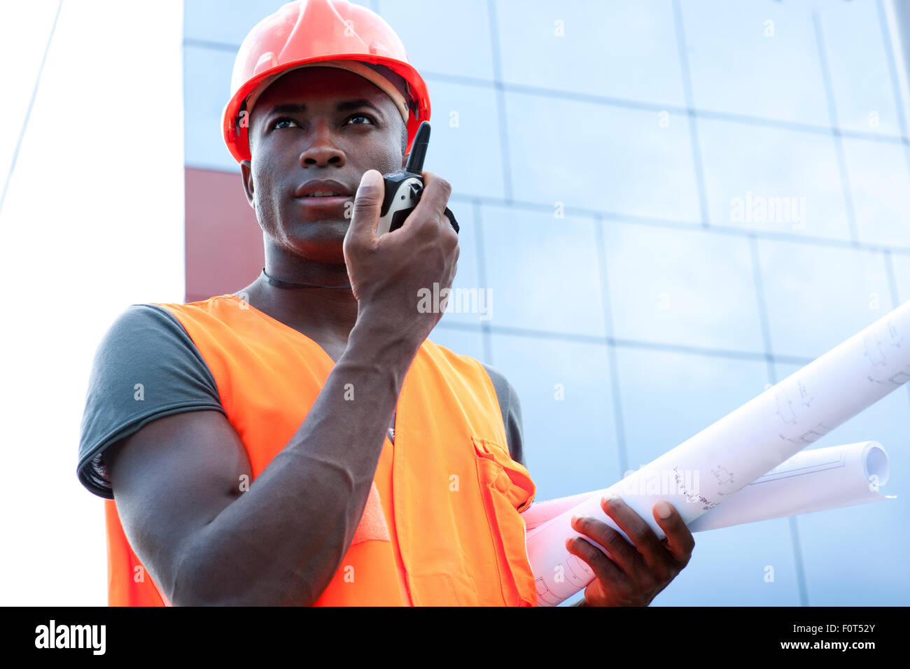 Construction worker speaking on Walkie-Talkie Stock Photo - Alamy
