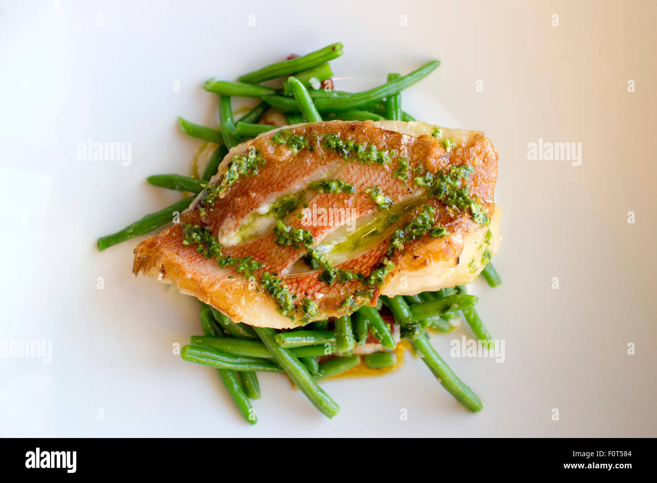 Red snapper fish and green beans Stock Photo - Alamy