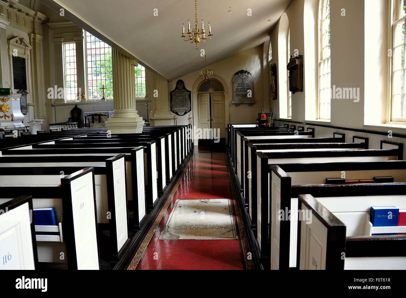Philadelphia, Pennsylvania: White boxed wooden pews with prayer hymnals ...