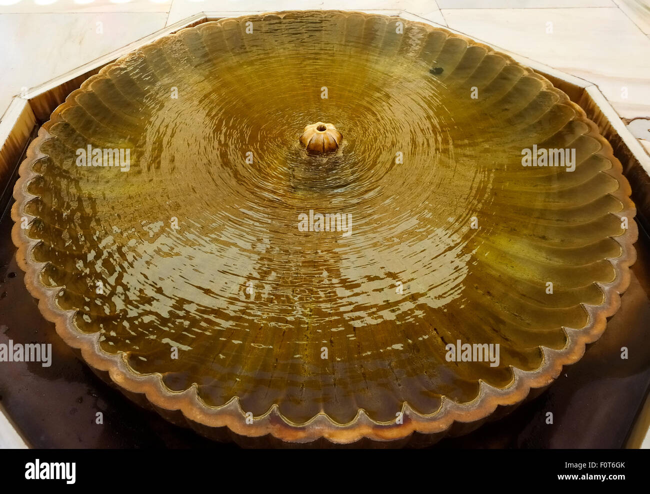Close up fountain in a floor with pebble pavement in the Alhambra,Spain ...