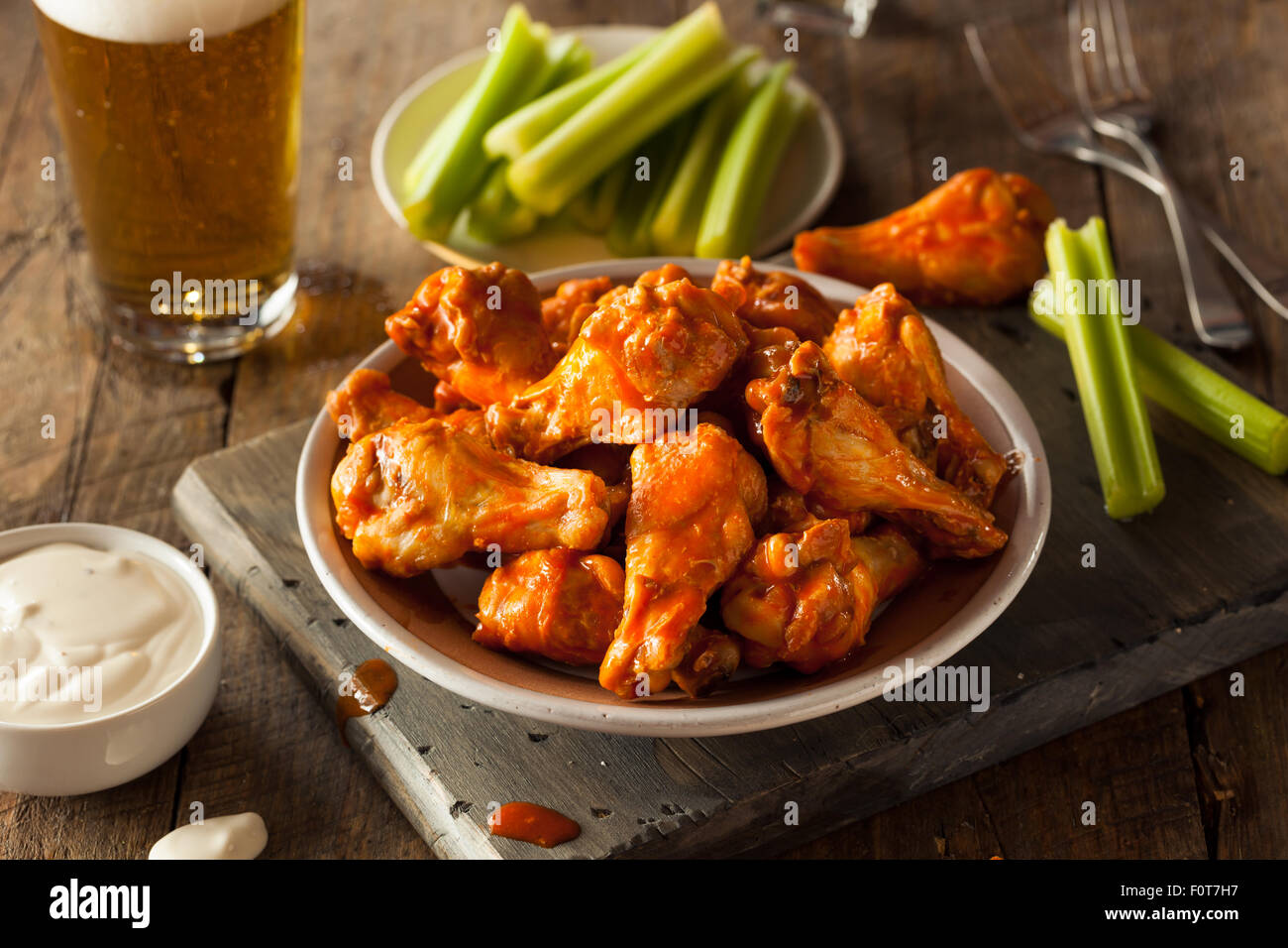 Spicy Homemade Buffalo Wings with Dip and Beer Stock Photo - Alamy