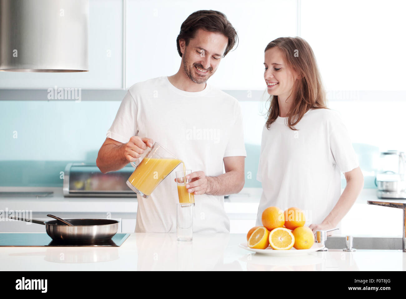 couple cooking breakfast Stock Photo - Alamy