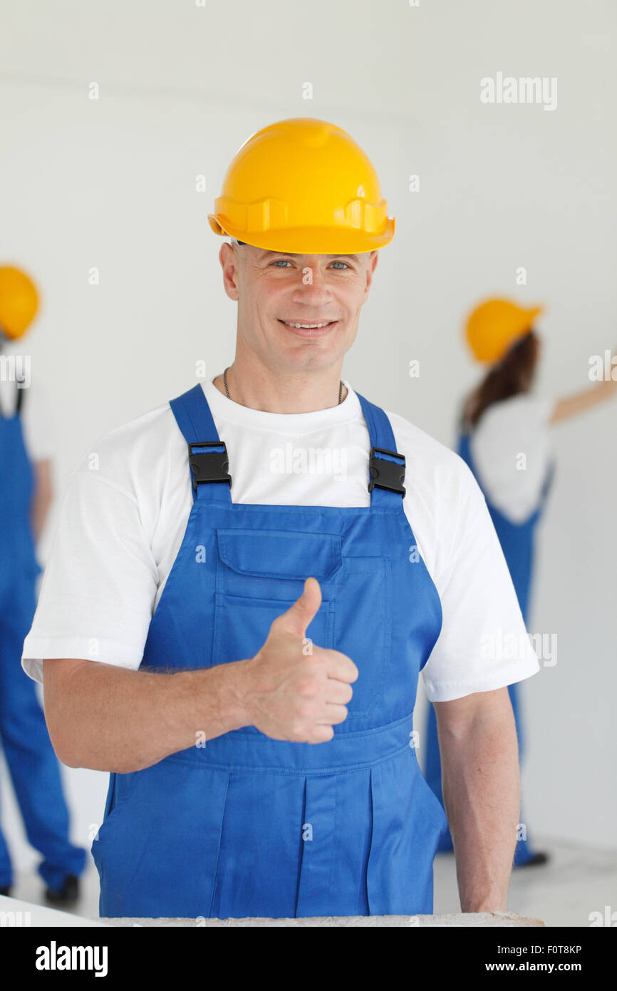 workman gives thumbs up Stock Photo - Alamy