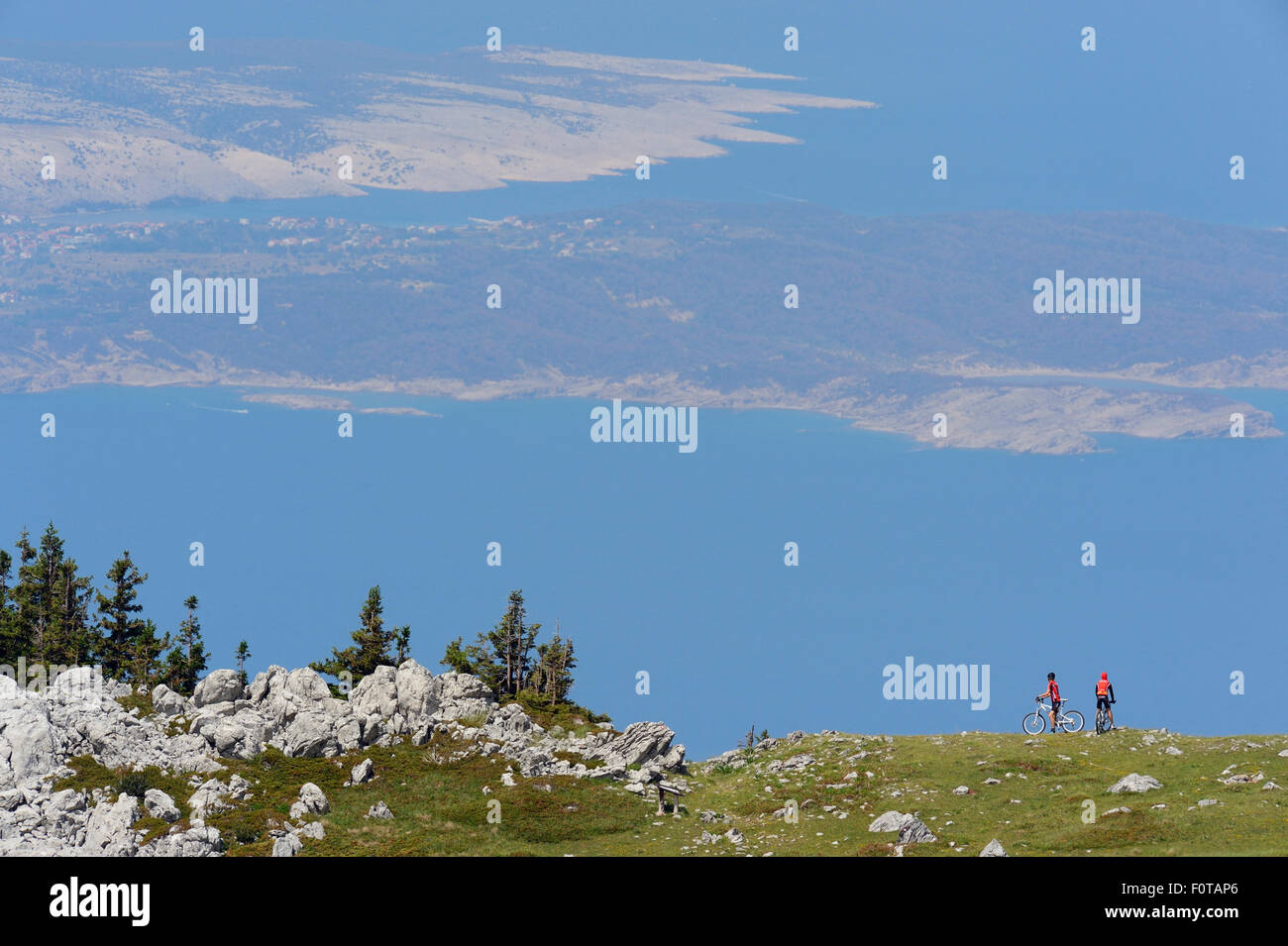 Bicyclists / mountain bikers in a long distance race with goal being ...