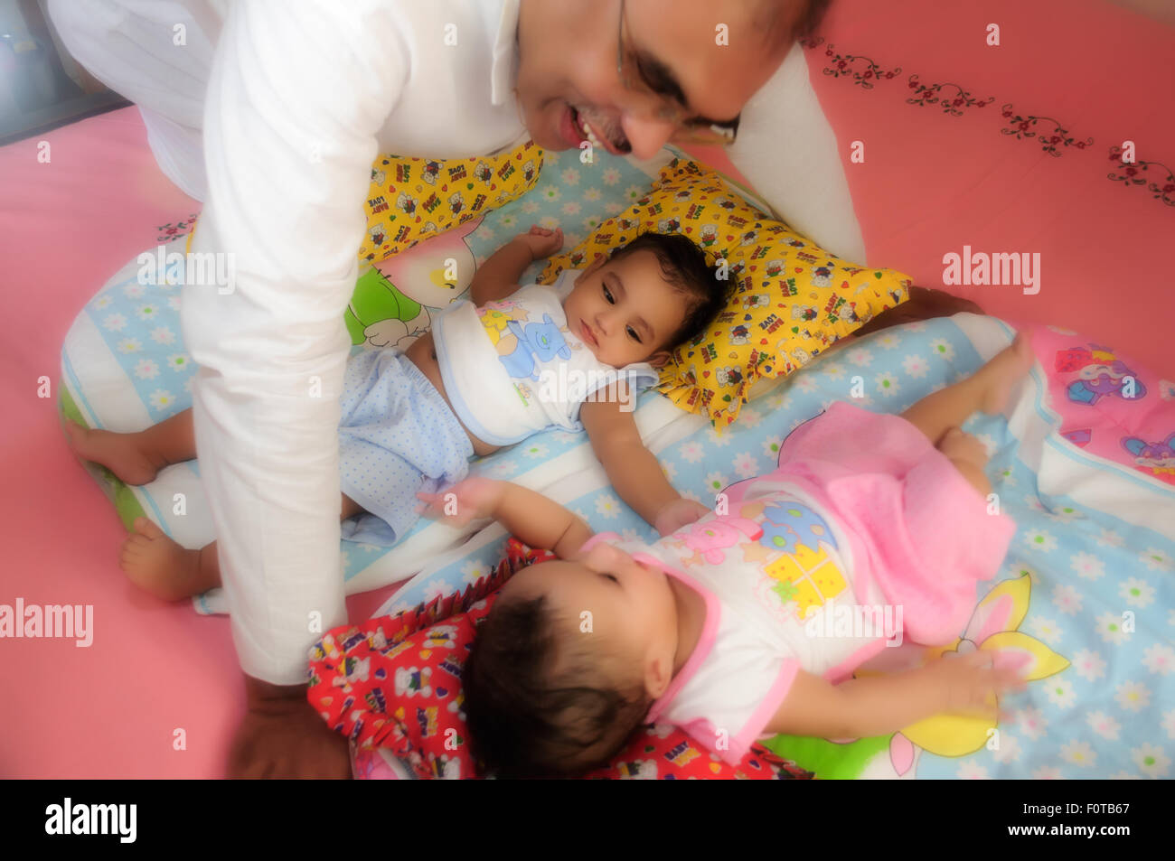Portrait of a happy family, Bengali father with sweet little son ...
