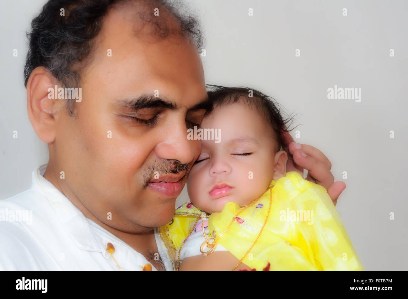 Portrait of a happy family, Bengali father with sweet little son ...