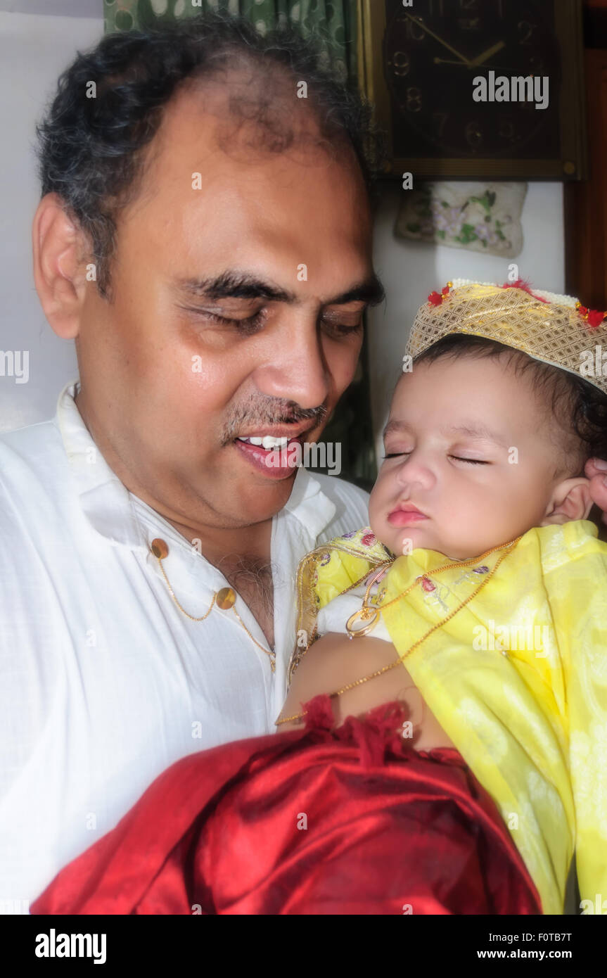 Portrait of a happy family, Bengali father with sweet little son ...