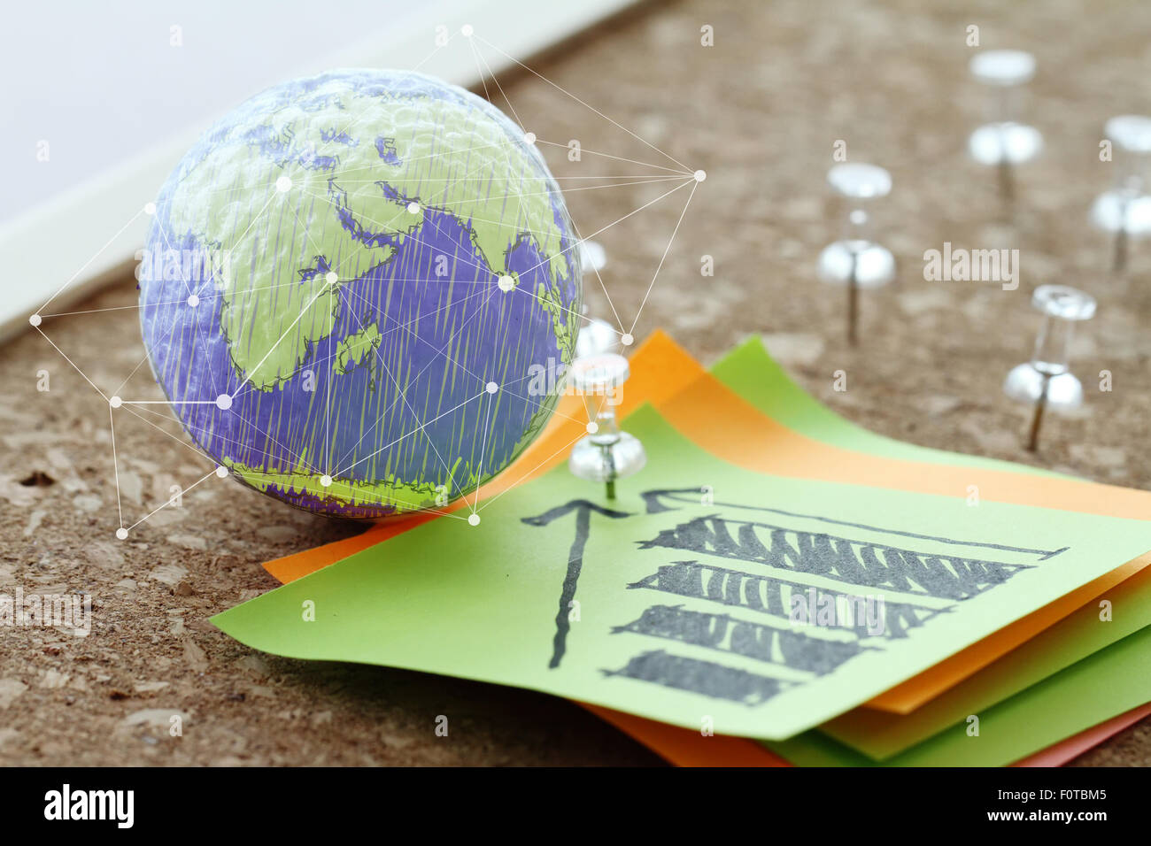 close up of pin and hand drawn business strategy graph chart on sticky ...