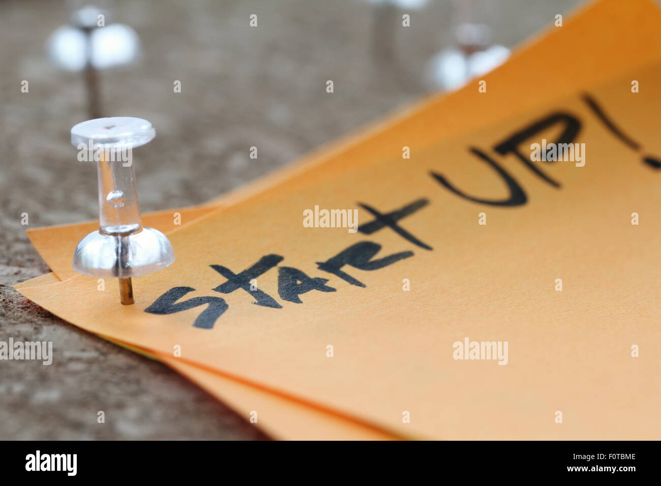 close up of pin and hand drawn business strategy graph chart on sticky ...