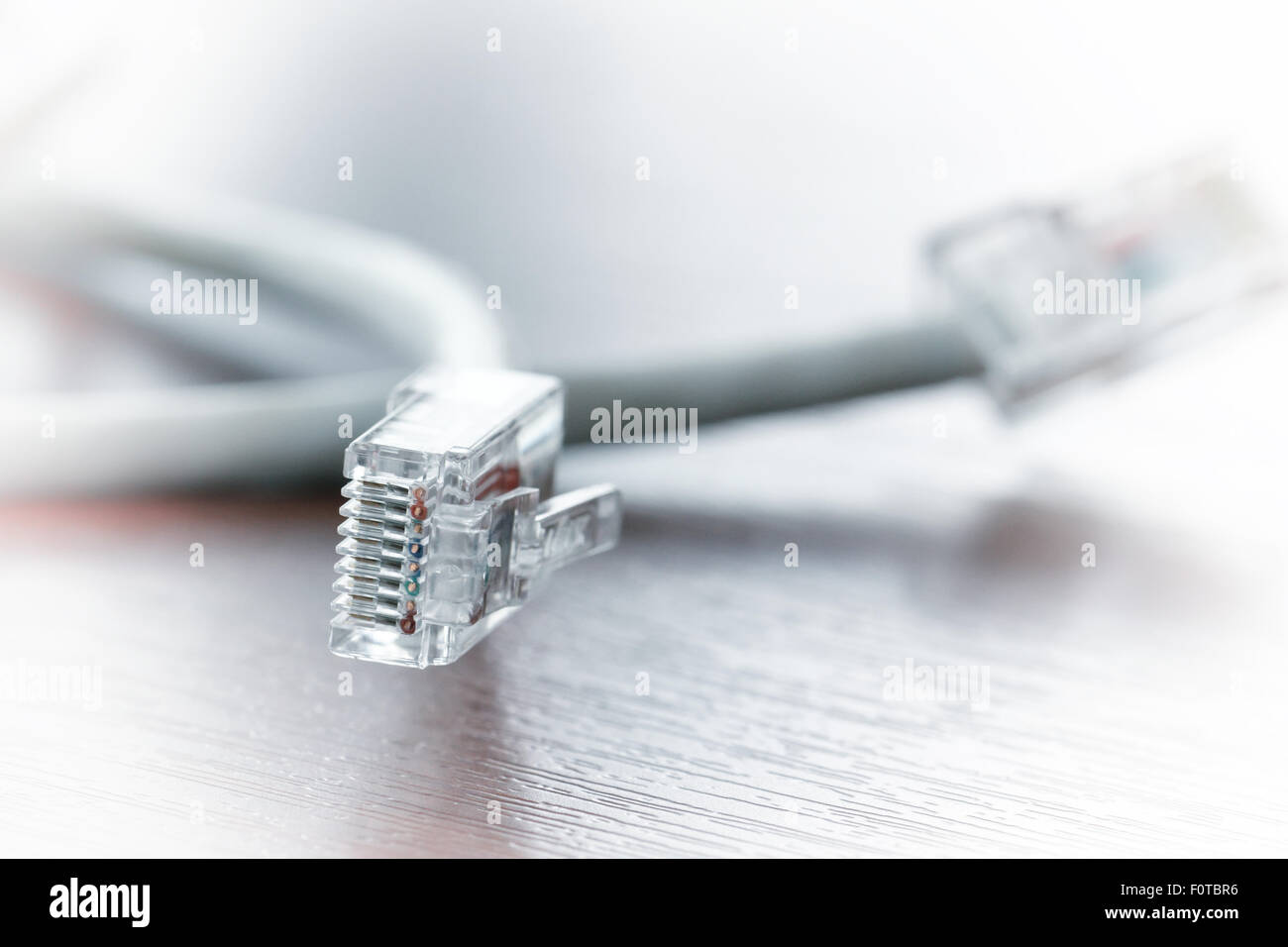 close up of RJ45 Plug Network on wood desk Stock Photo - Alamy