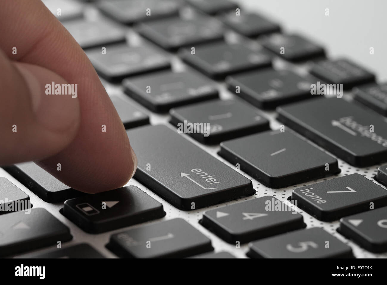 close up of businessman finger use keyboard laptop computer as concept ...