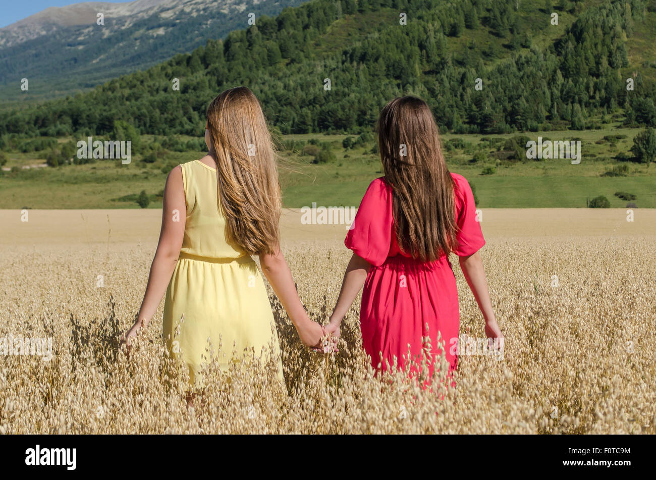 girl walking in field Stock Photo - Alamy