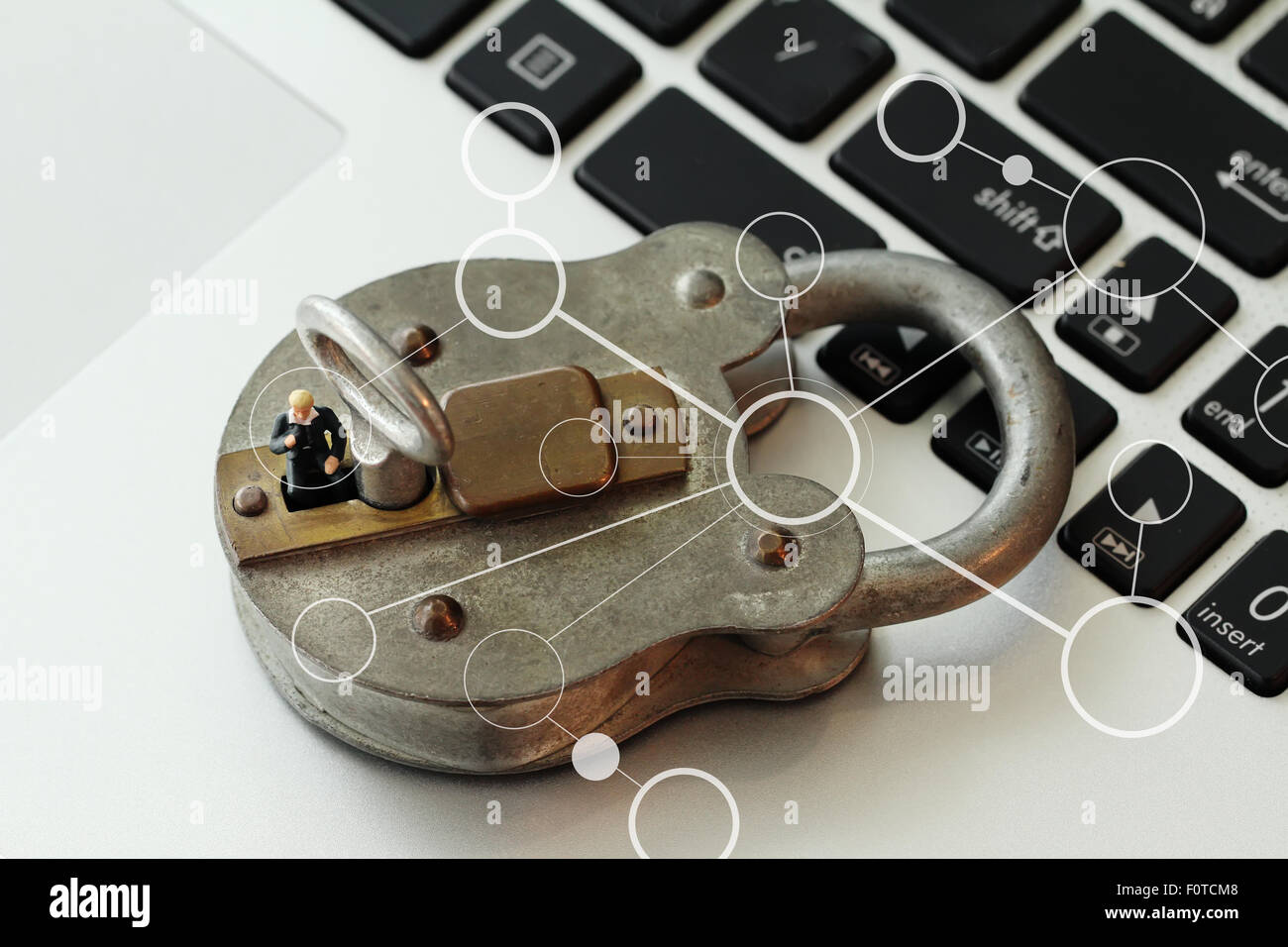 Internet security concept-old padlock and key on laptop computer ...