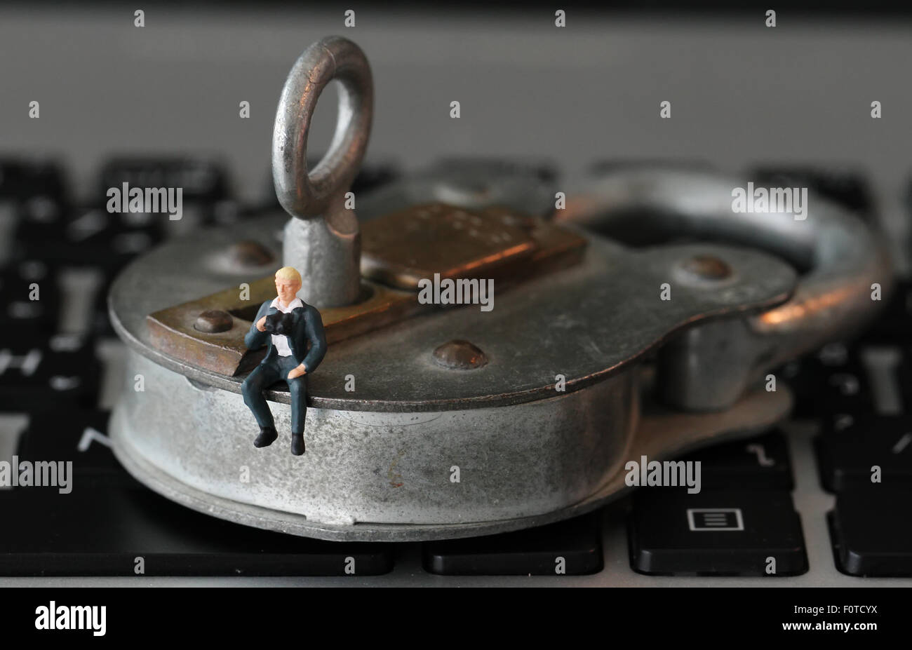 Internet security concept-old padlock and key on laptop computer ...