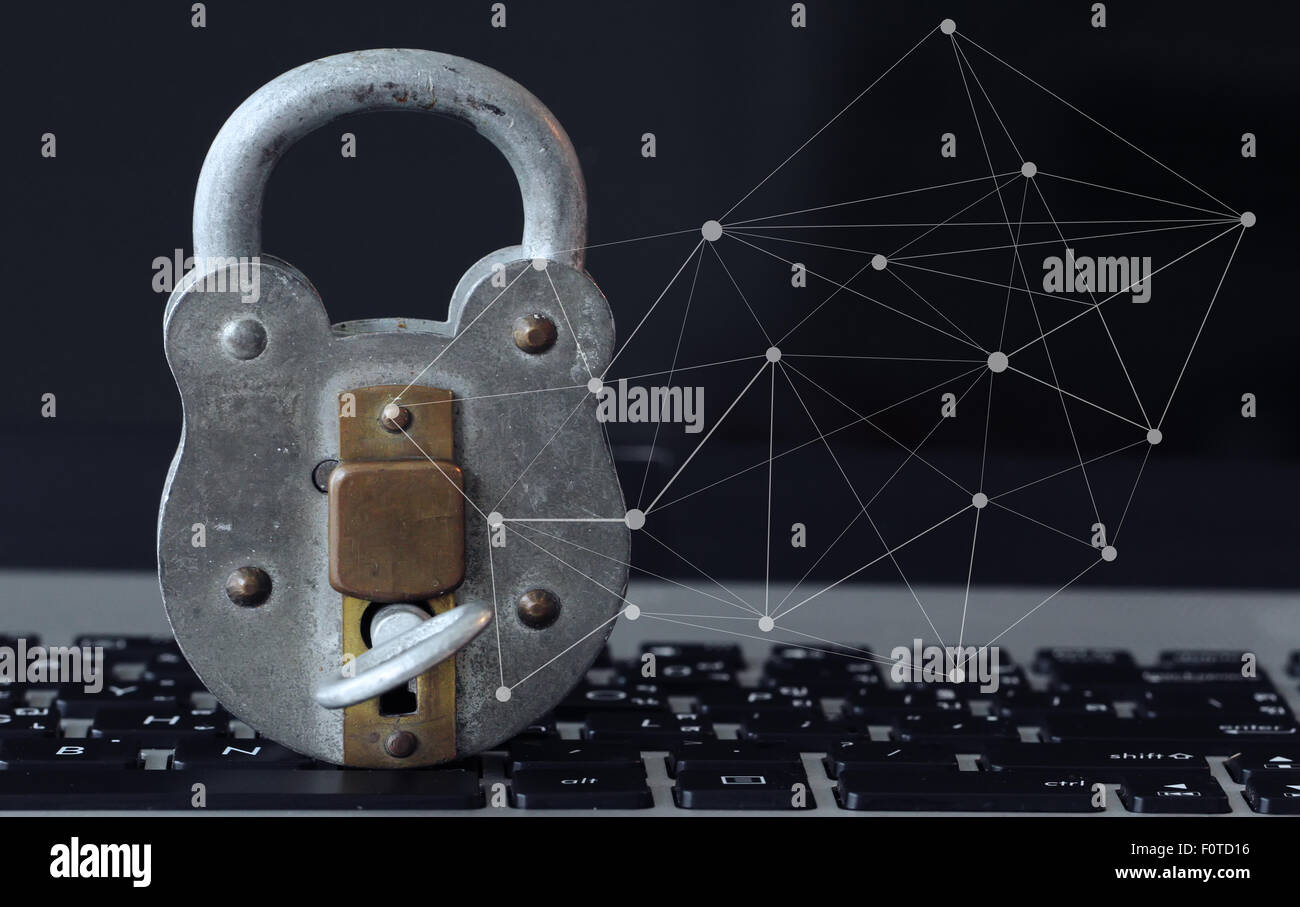 Internet security concept-old padlock and key on laptop computer ...