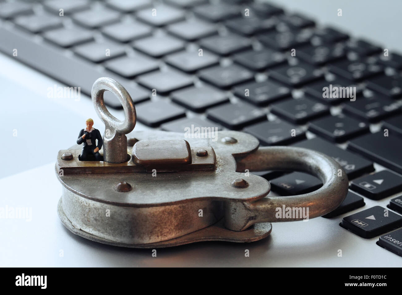 Internet security concept-old padlock and key on laptop computer ...