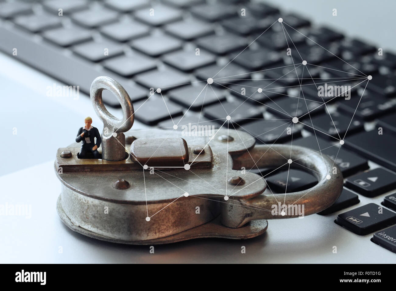 Internet security concept-old padlock and key on laptop computer ...