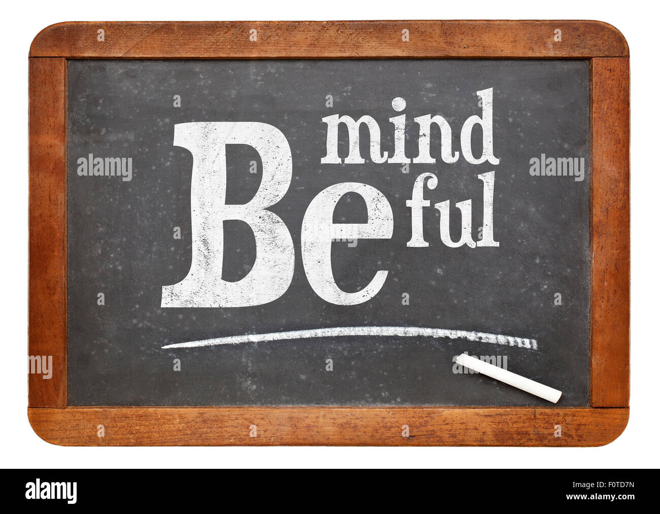 Be mindful sign - motto or resolution on a vintage slate blackboard ...