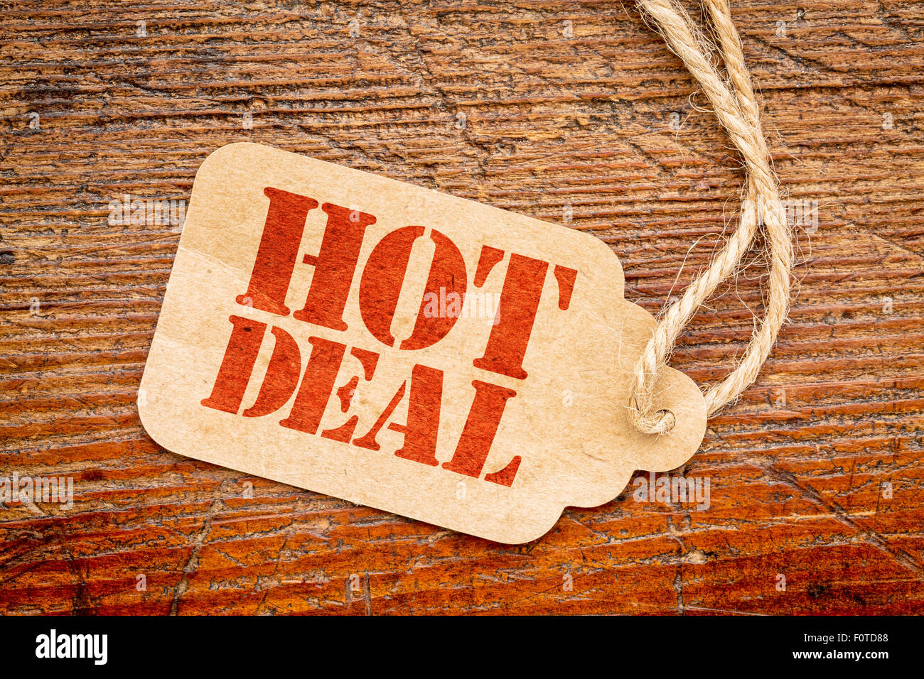 hot deal sign a paper price tag against rustic red painted barn wood ...