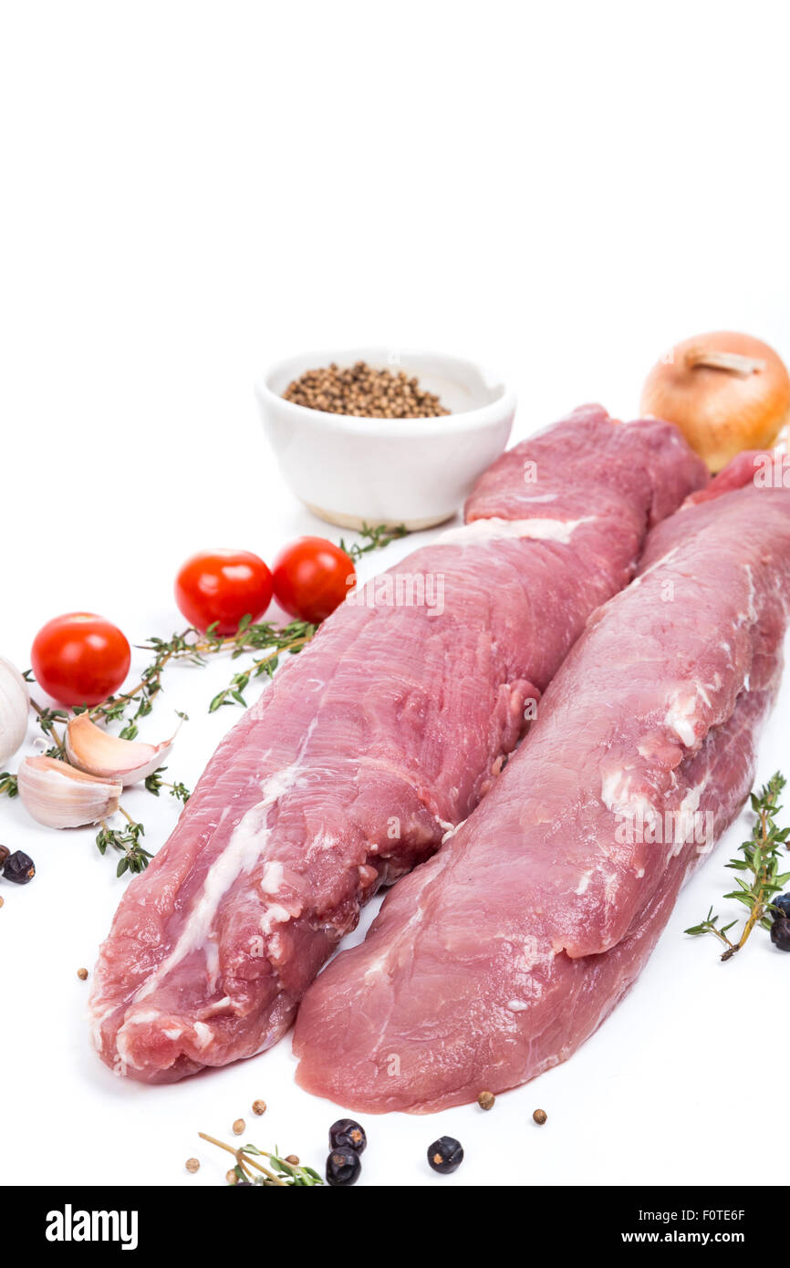uncooked raw meat fillet with serving spices on white background Stock ...