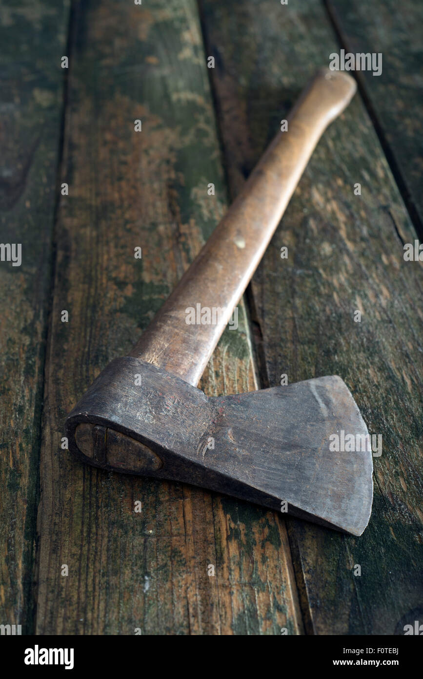 old ax on wood background Stock Photo - Alamy