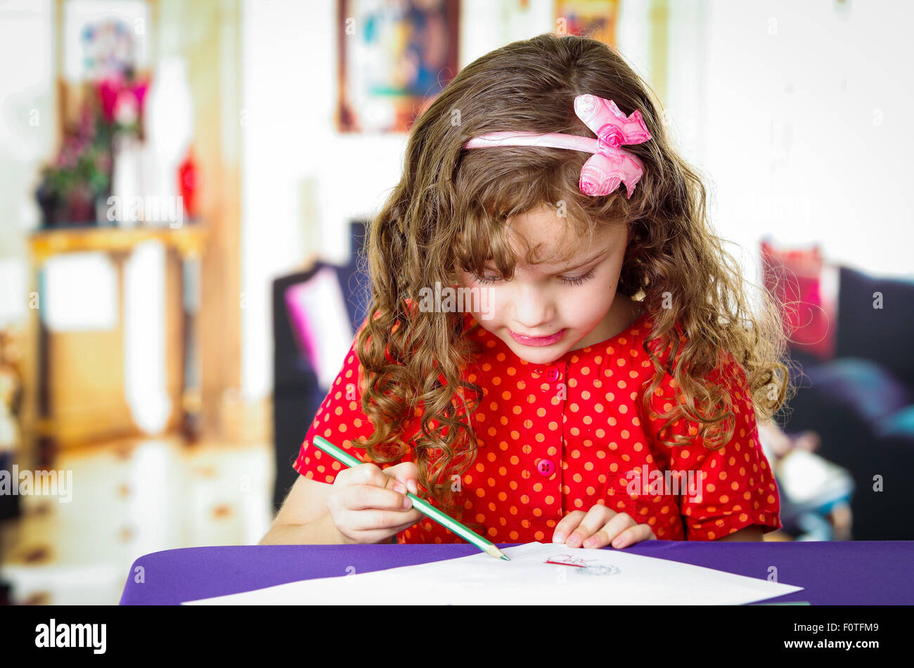 Cute little girl doing her homework Stock Photo - Alamy
