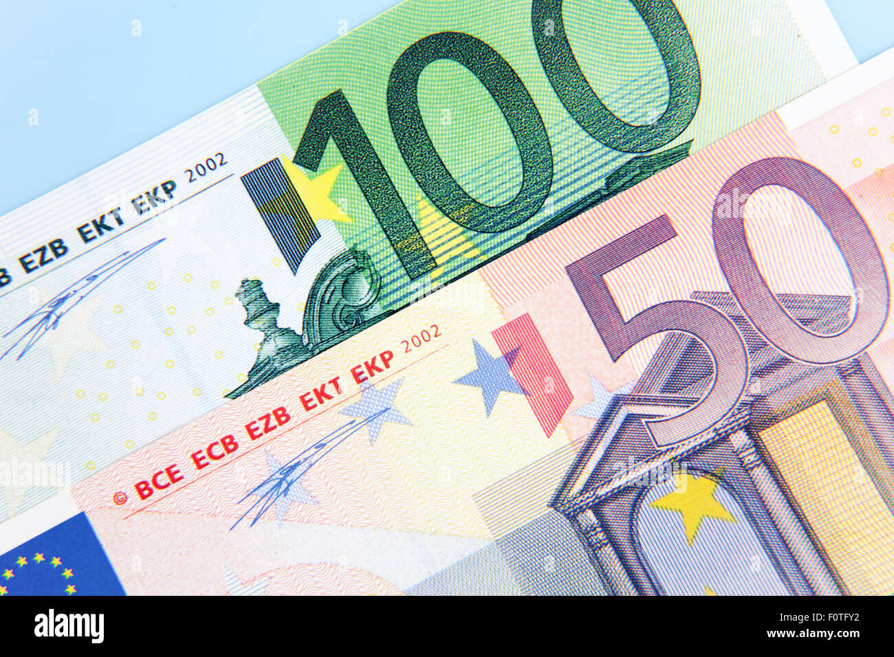 150 euro on light blue background Stock Photo - Alamy